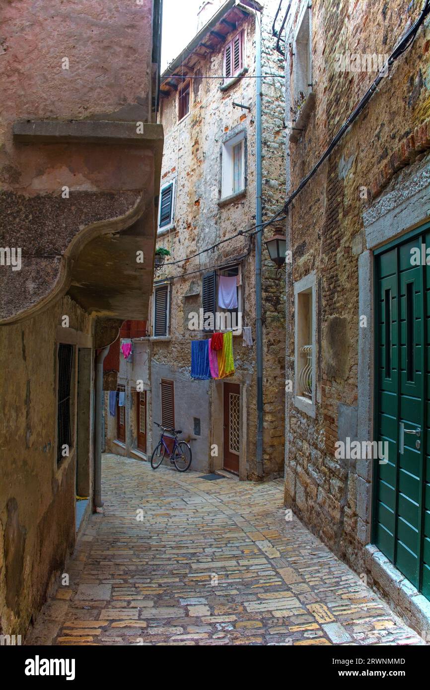 A quiet street in the historic centre of the medieval coastal town of ...