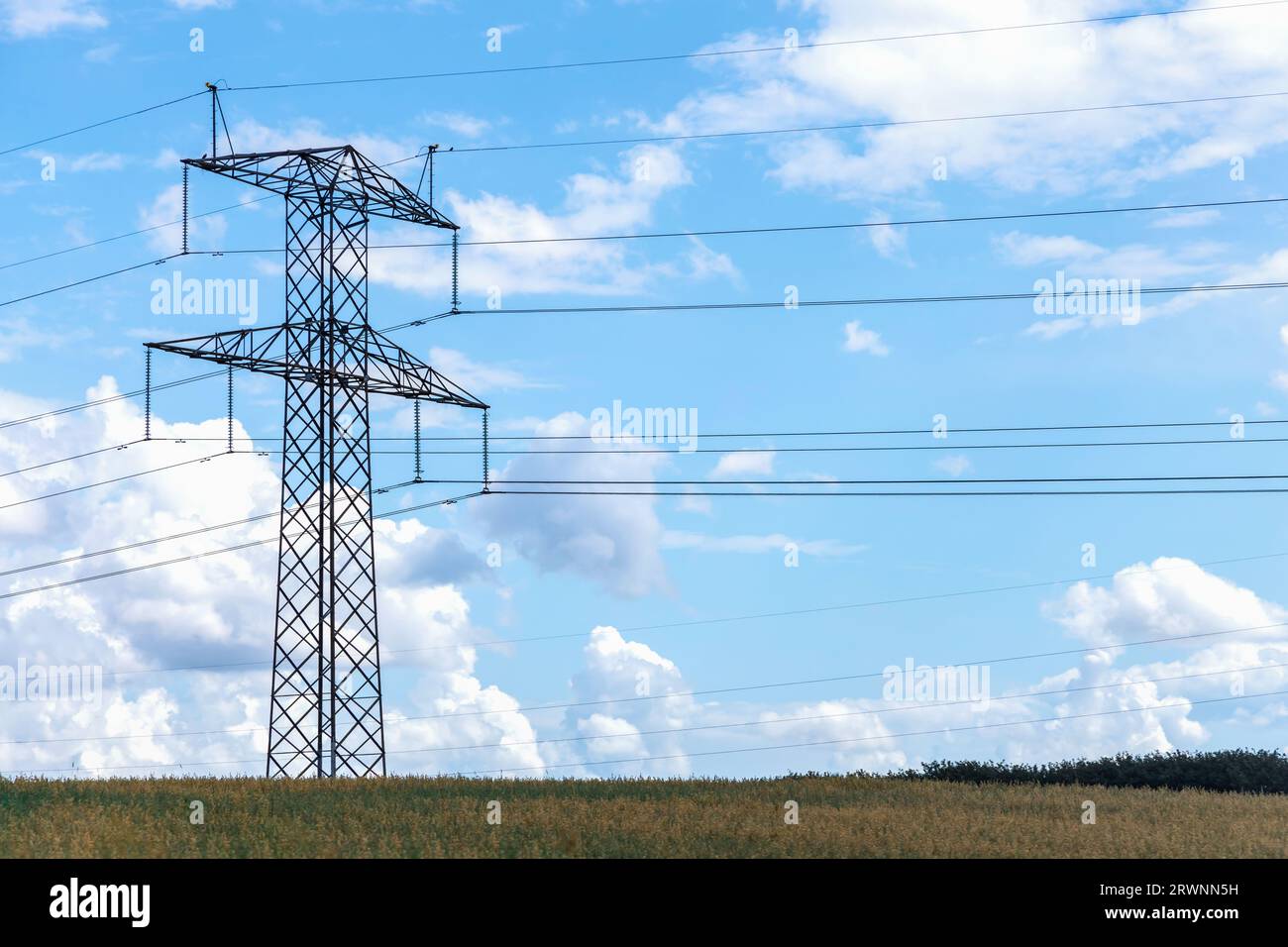 Electricity concept. High voltage power line pylons, electrical tower ...