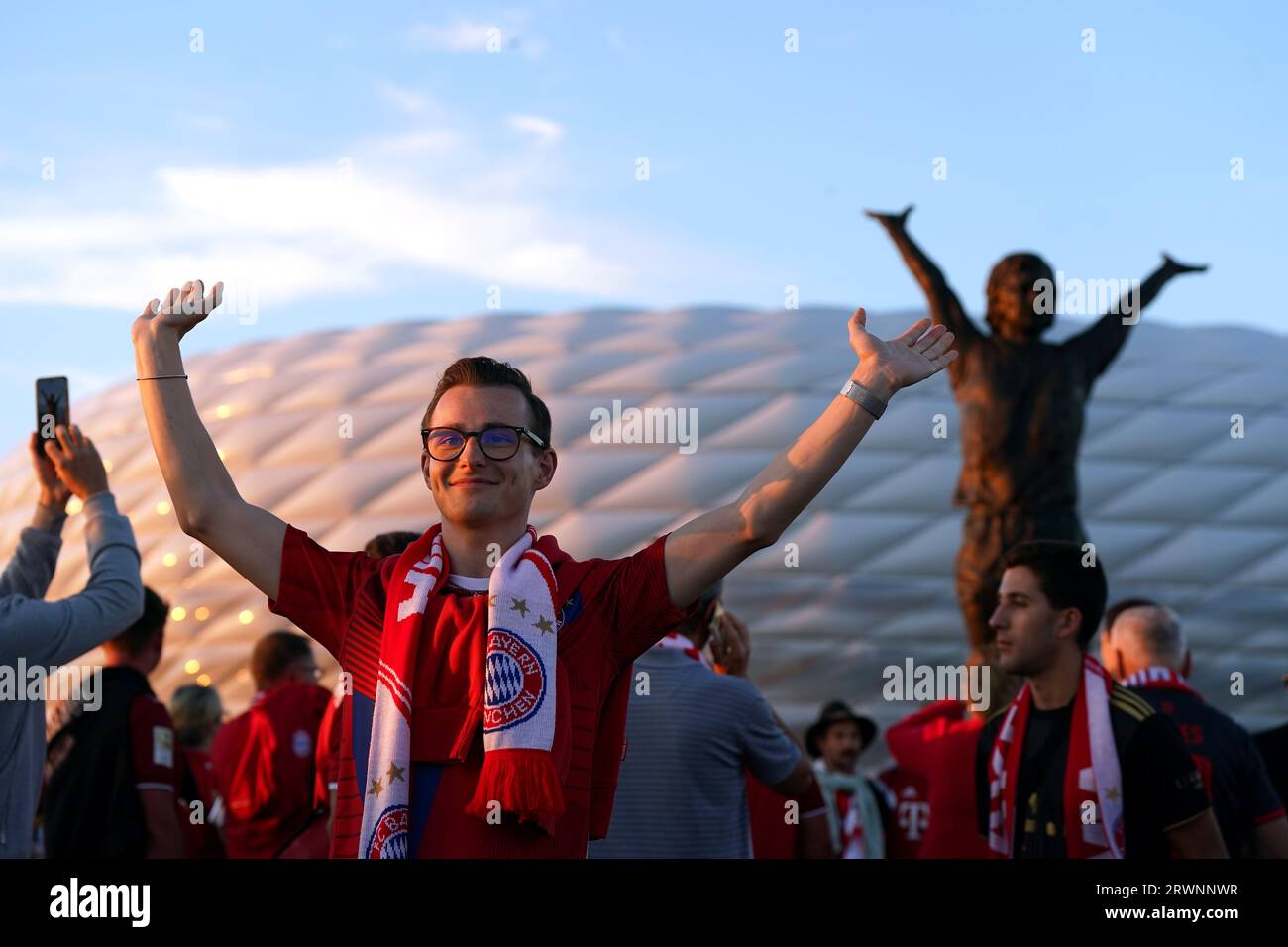 Bayern Munich fans next to the Gerd Muller statue outside the stadium ...