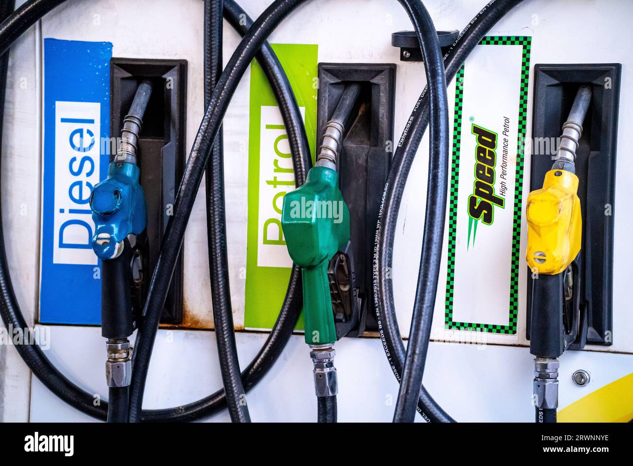 Fuel nozzles for diesel, petrol and speed showing a petrol pump fuel ...