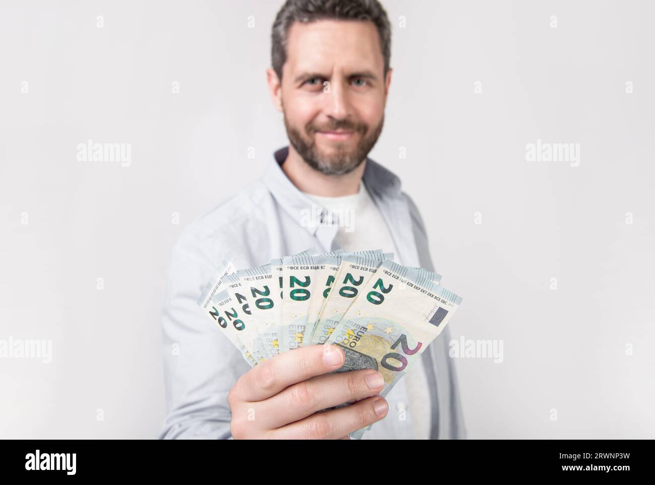 smiling man with salary money banknotes. photo of man with salary money ...