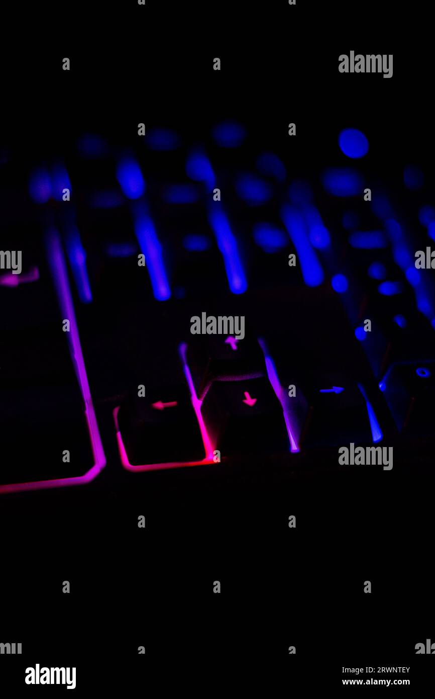 Backlit keyboard of a personal computer, with out-of-focus keys, on a ...