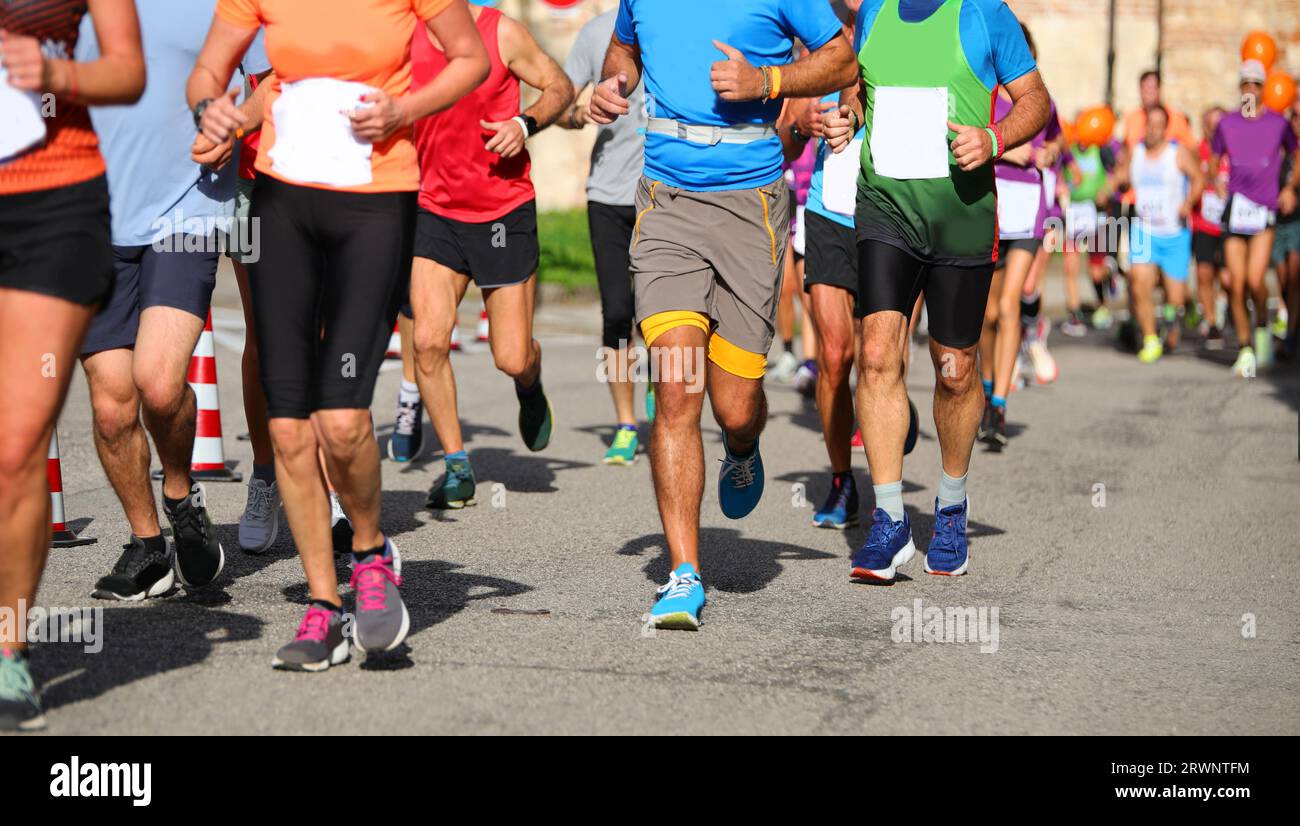 group of runners during the footrace in the street of the city Stock ...