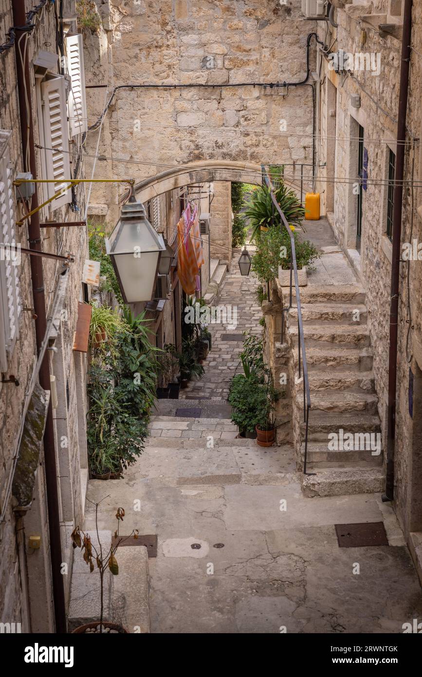 The medieval city of Dubrovnik, Dalmatia, Croatia. Narrow street with a ...