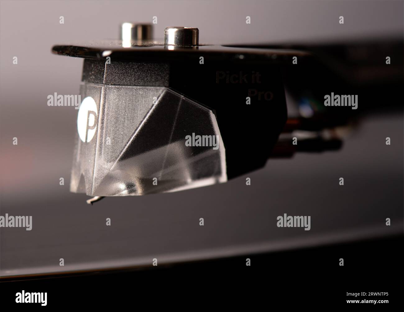 Pro-ject cartridge and stylus on a tonearm of a record player turntable ...