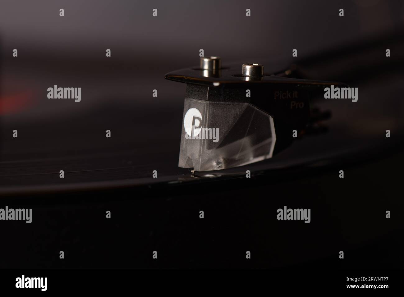Pro-ject cartridge and stylus on a tonearm of a record player turntable ...