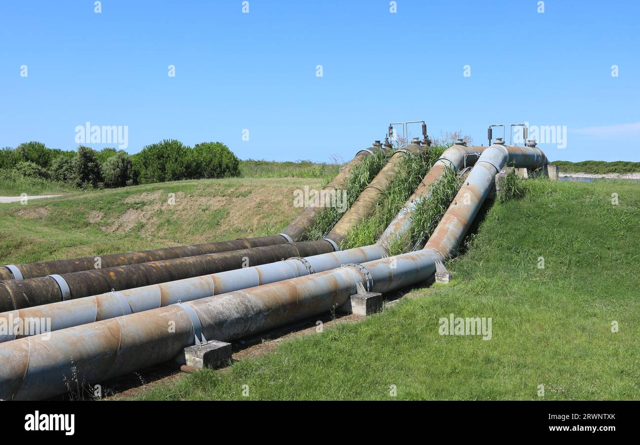 Four steel pipes for water drainage connected to a very powerful pump ...