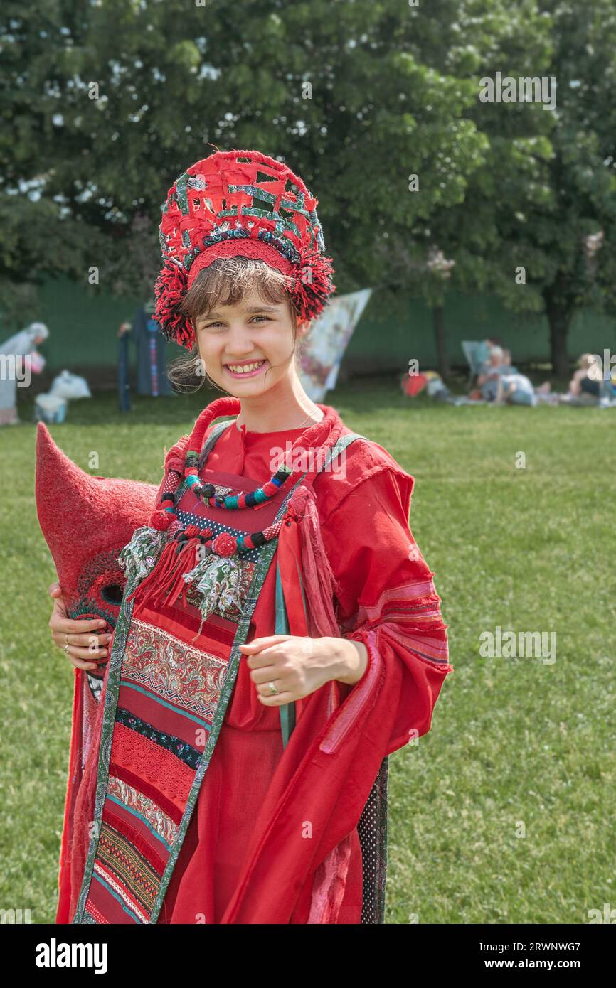 Kolomna, Russia, June 12, 2022. A beautiful young woman shows off her ...