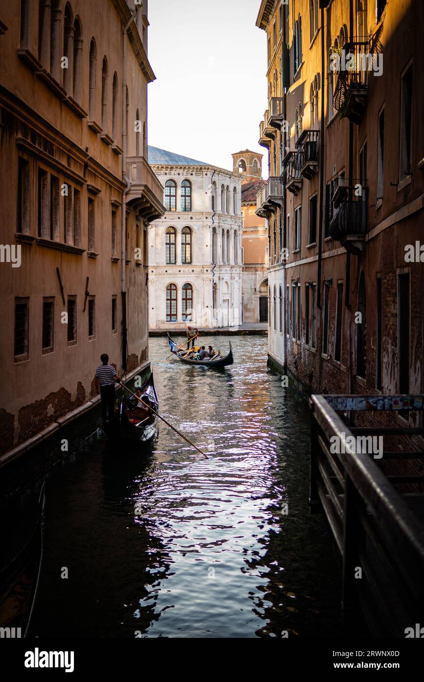 Aerial view of a vibrant cityscape featuring a winding canal lined with ...