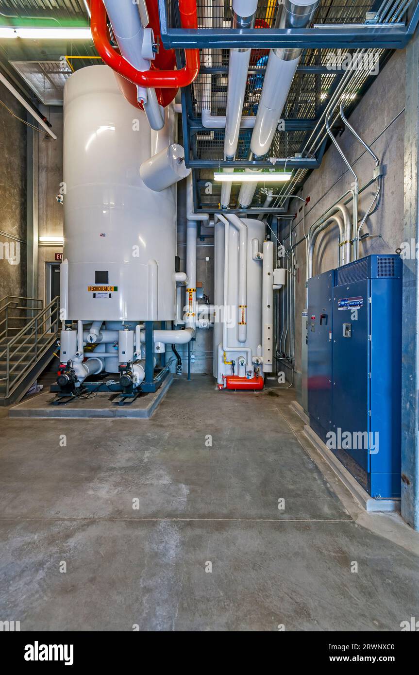 A vertical tank in an ammonia-cycle industrial refrigeration cold ...