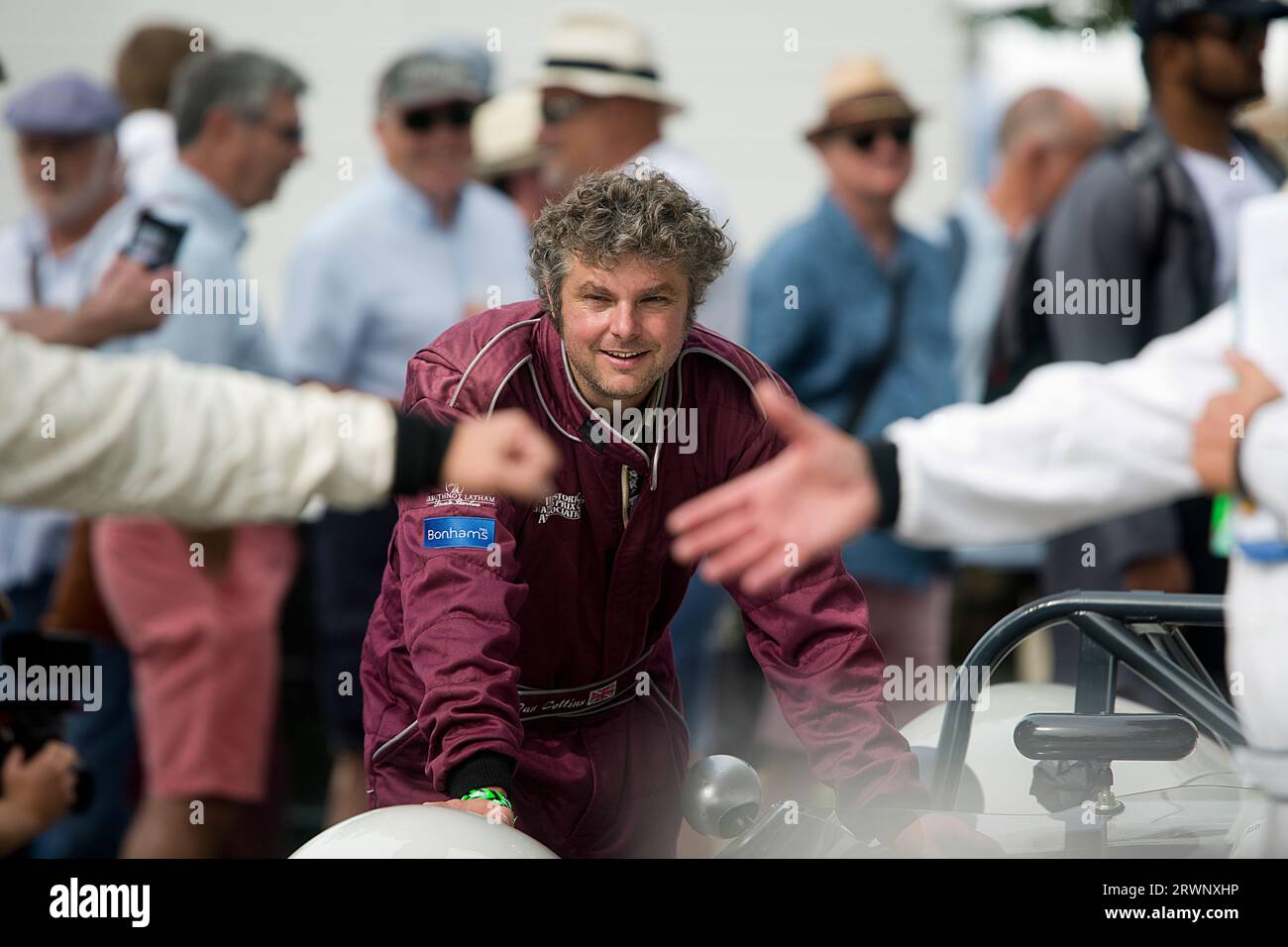 Dan Collins pushing his 1961 Lotus-Climax 21 into the Assembly Area for ...