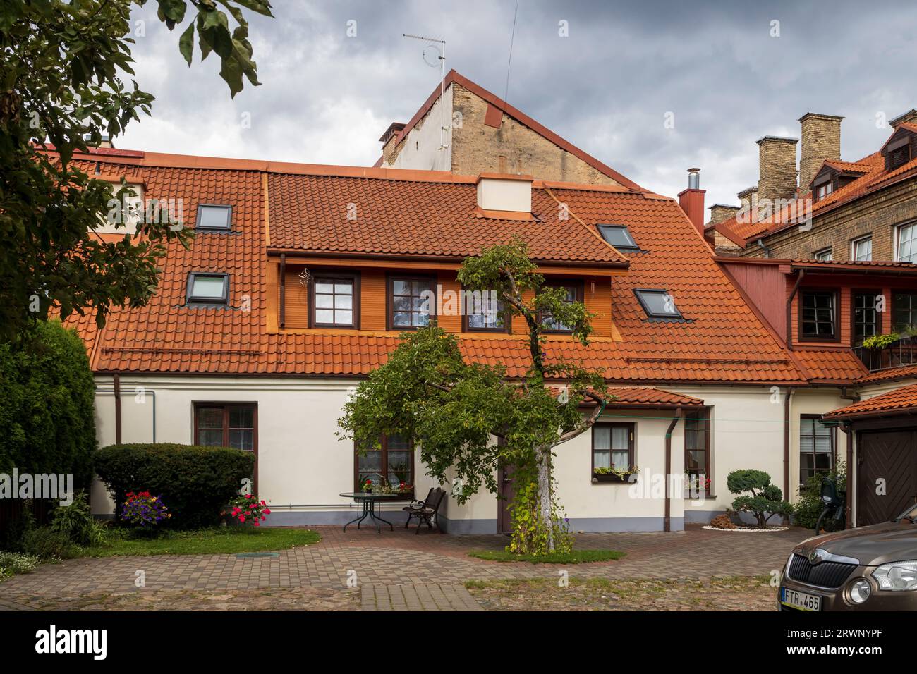 Vilnius, Lithuania - August 23, 2023, Old yard overgrown with plants ...