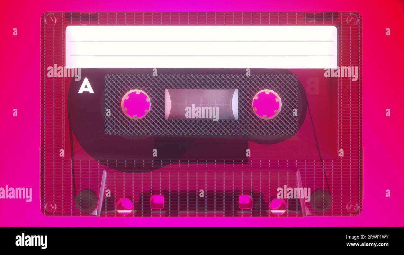 Rotating tape on an old vintage cassette. Retro music concept. Radio ...