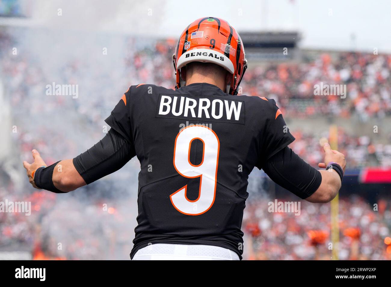 Cincinnati Bengals quarterback Joe Burrow runs onto the field during an ...