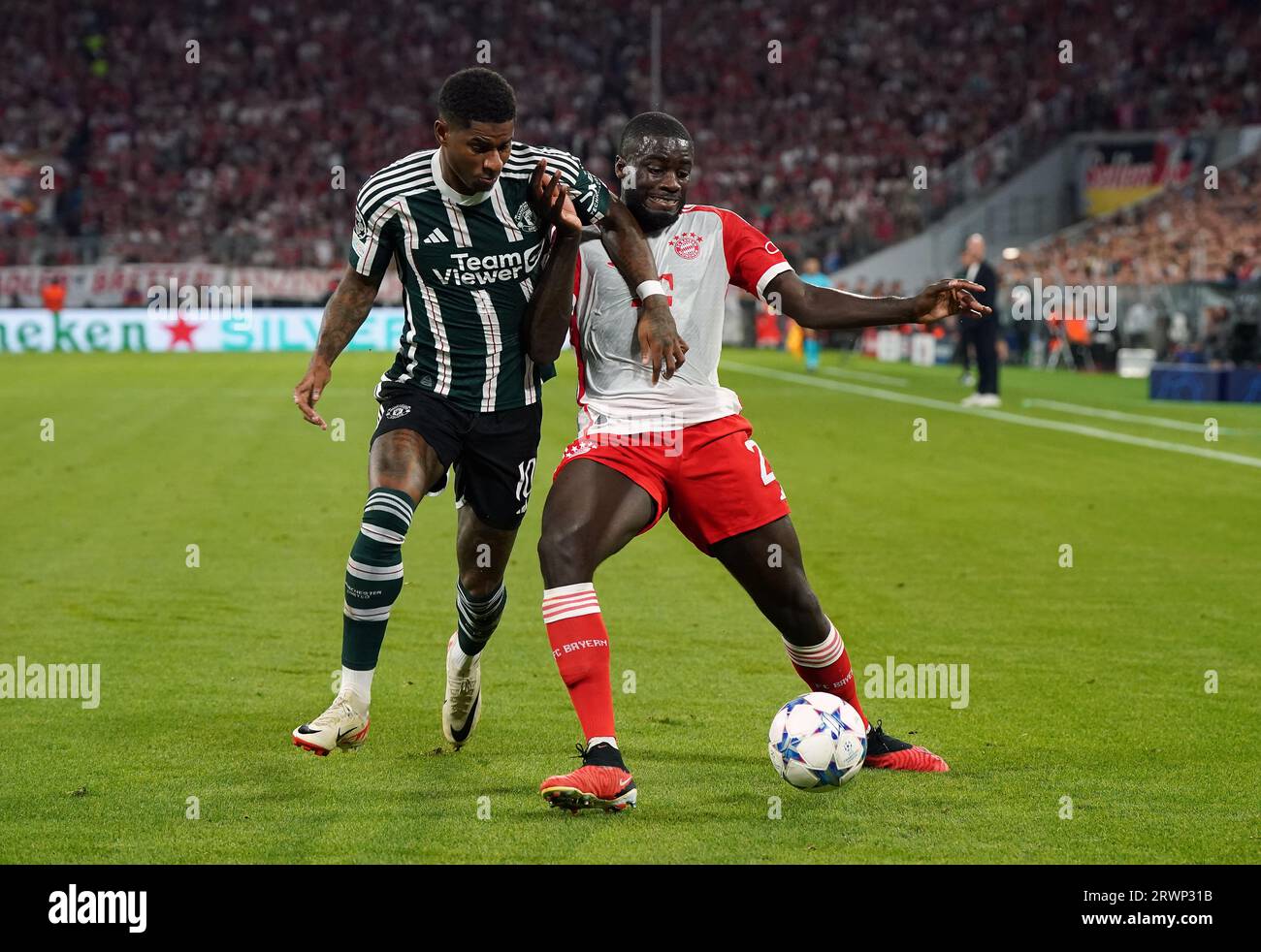 Bayern Munich's Dayot Upamecano and Manchester United's Marcus Rashford ...