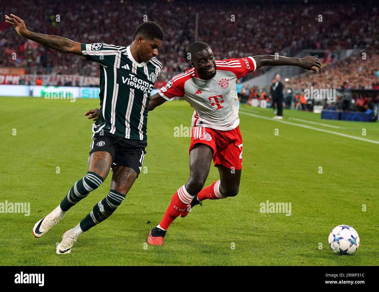 Bayern Munich's Dayot Upamecano and Manchester United's Marcus Rashford ...