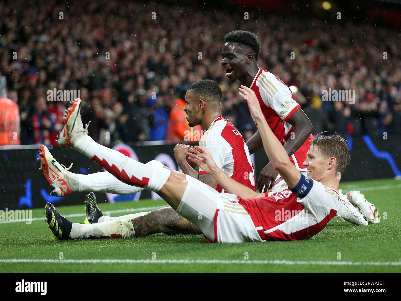 Arsenal's Gabriel Jesus (centre) celebrates with Bukayo Saka (top) and ...
