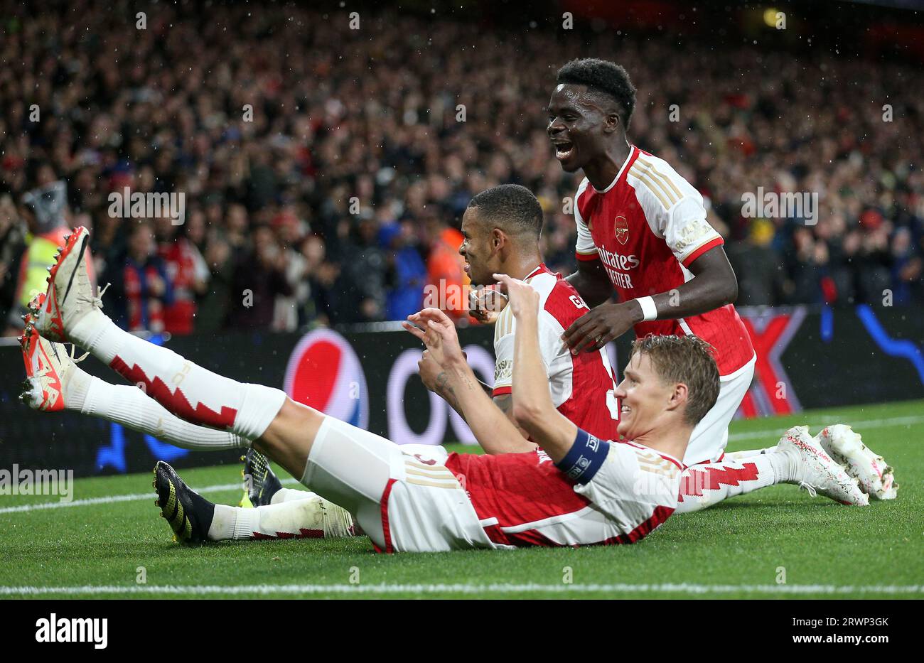 Arsenal's Gabriel Jesus (centre) celebrates with Bukayo Saka (top) and ...