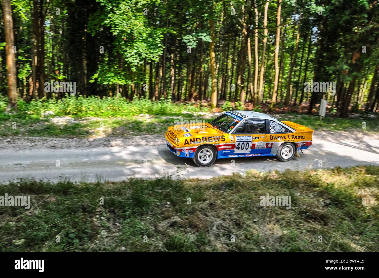 Opel Manta 400 Group B rally car racing through the forest rally stage ...
