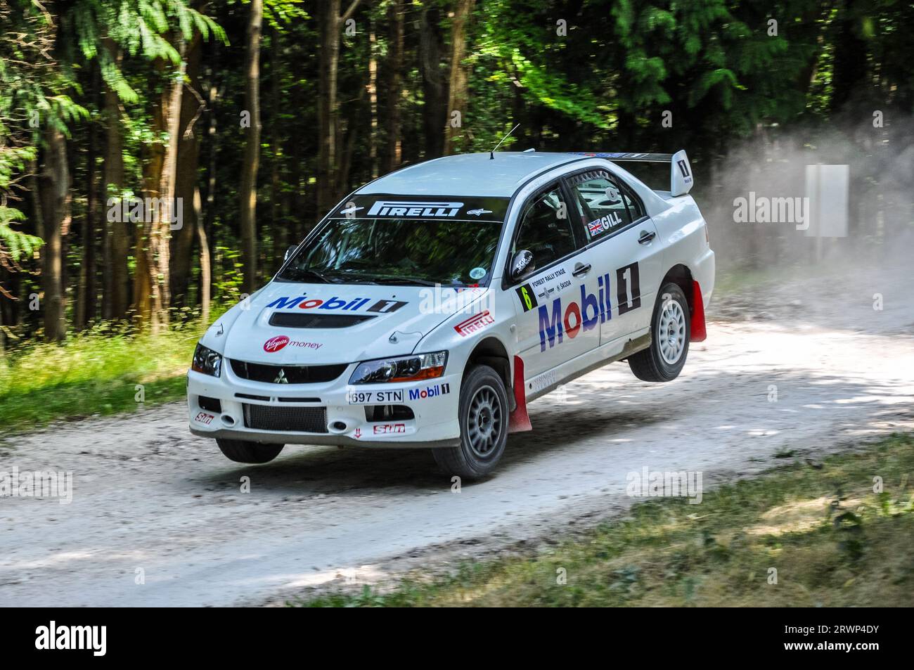 Mitsubishi Lancer EVO IX rally car racing on the special forest stage ...