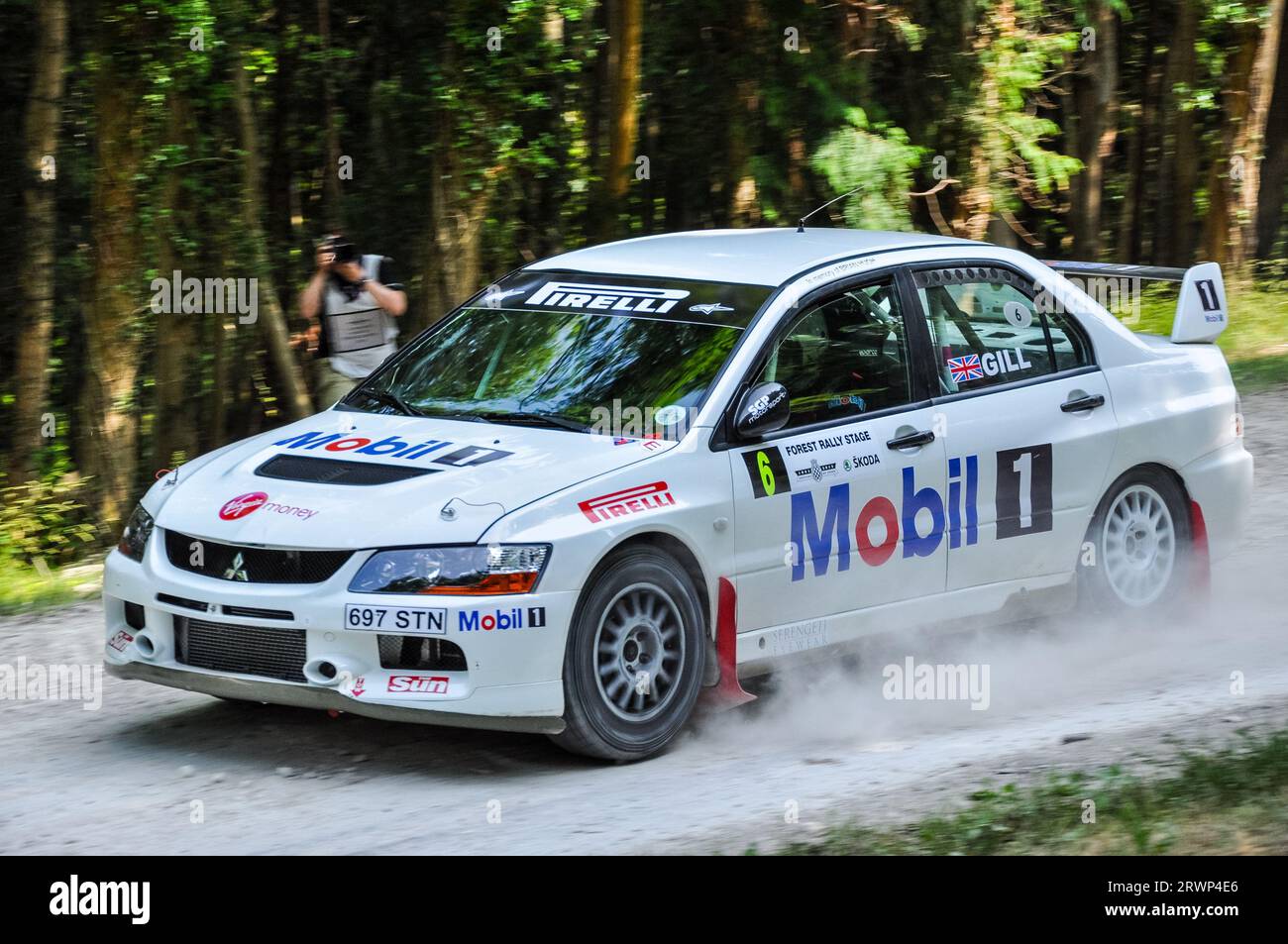 Mitsubishi Lancer EVO IX rally car racing on the special forest stage ...