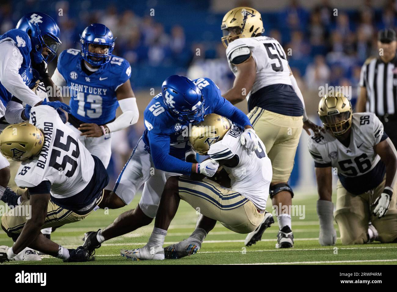Kentucky linebacker Keaten Wade (20) sacks Akron quarterback DJ Irons ...