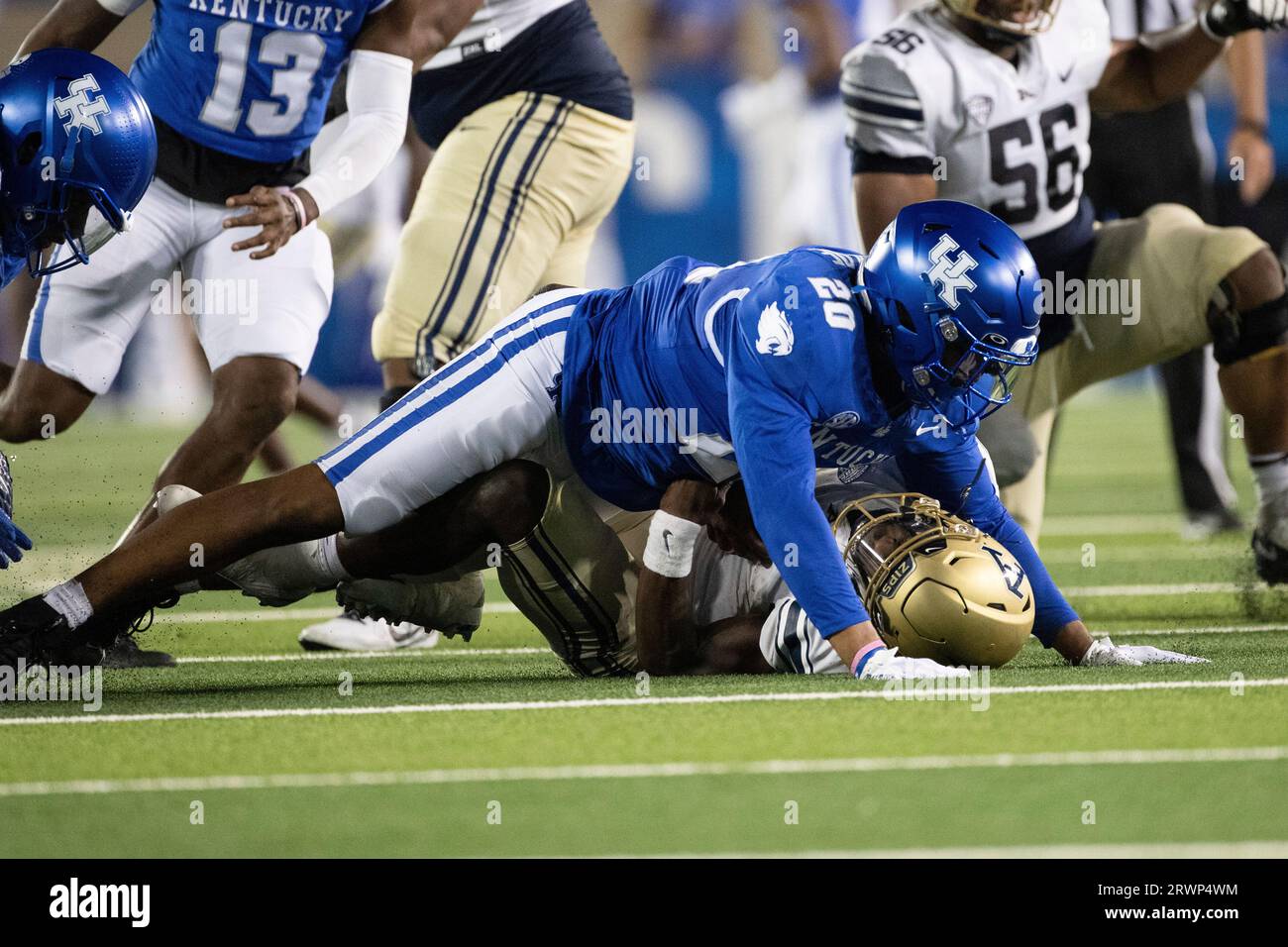 Kentucky linebacker Keaten Wade (20) sacks Akron quarterback DJ Irons ...