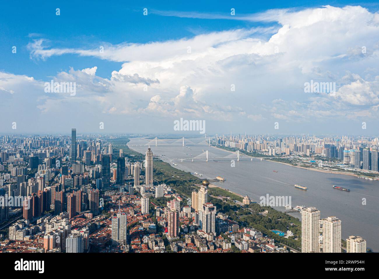 An aerial view of a vibrant metropolitan cityscape featuring a cluster ...