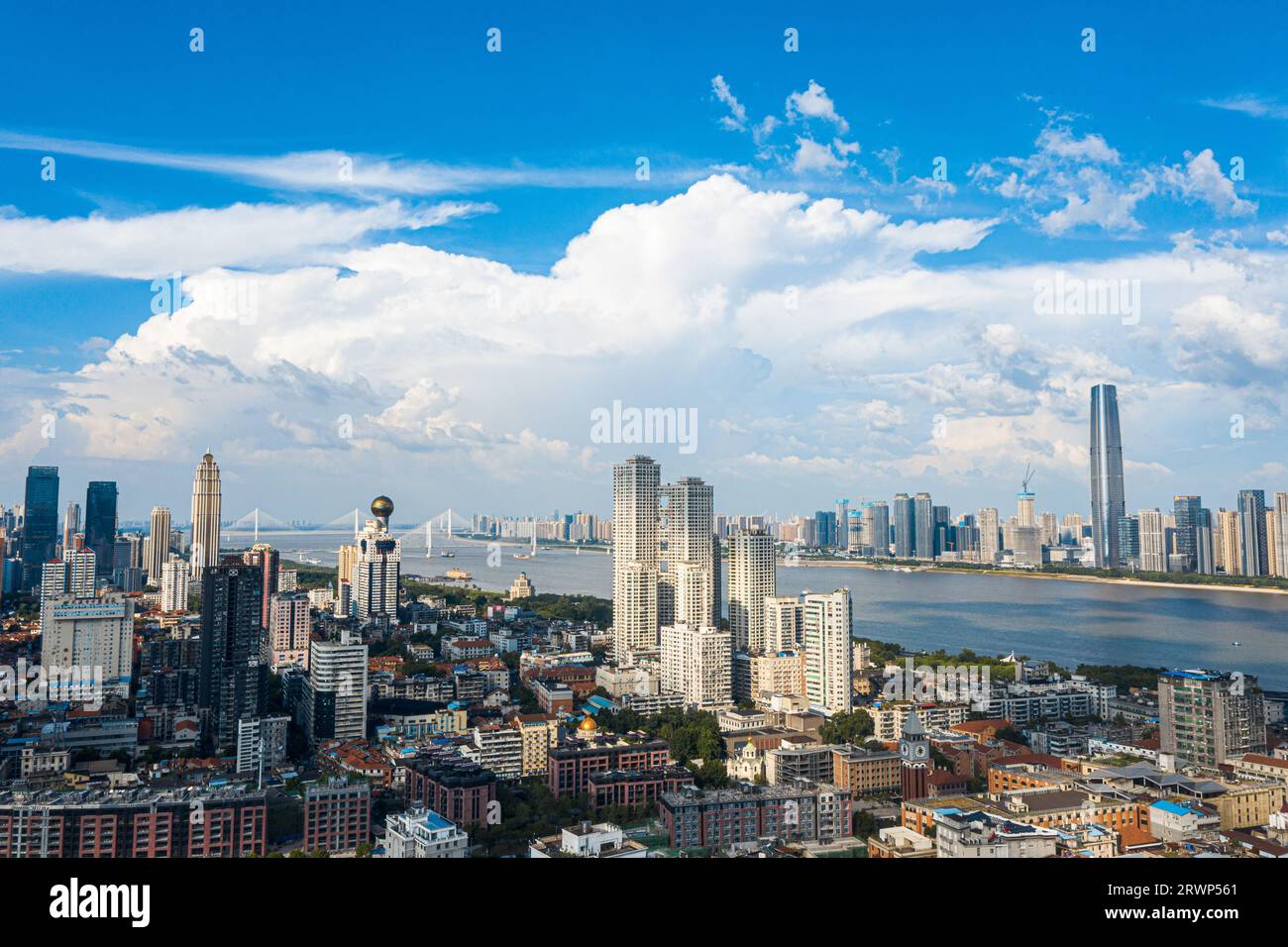 An aerial view of a vibrant metropolitan cityscape featuring a cluster ...