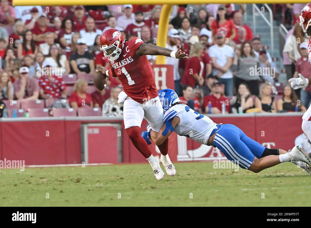 Arkansas quarterback KJ Jefferson (1) is sacked by BYU linebacker Max ...