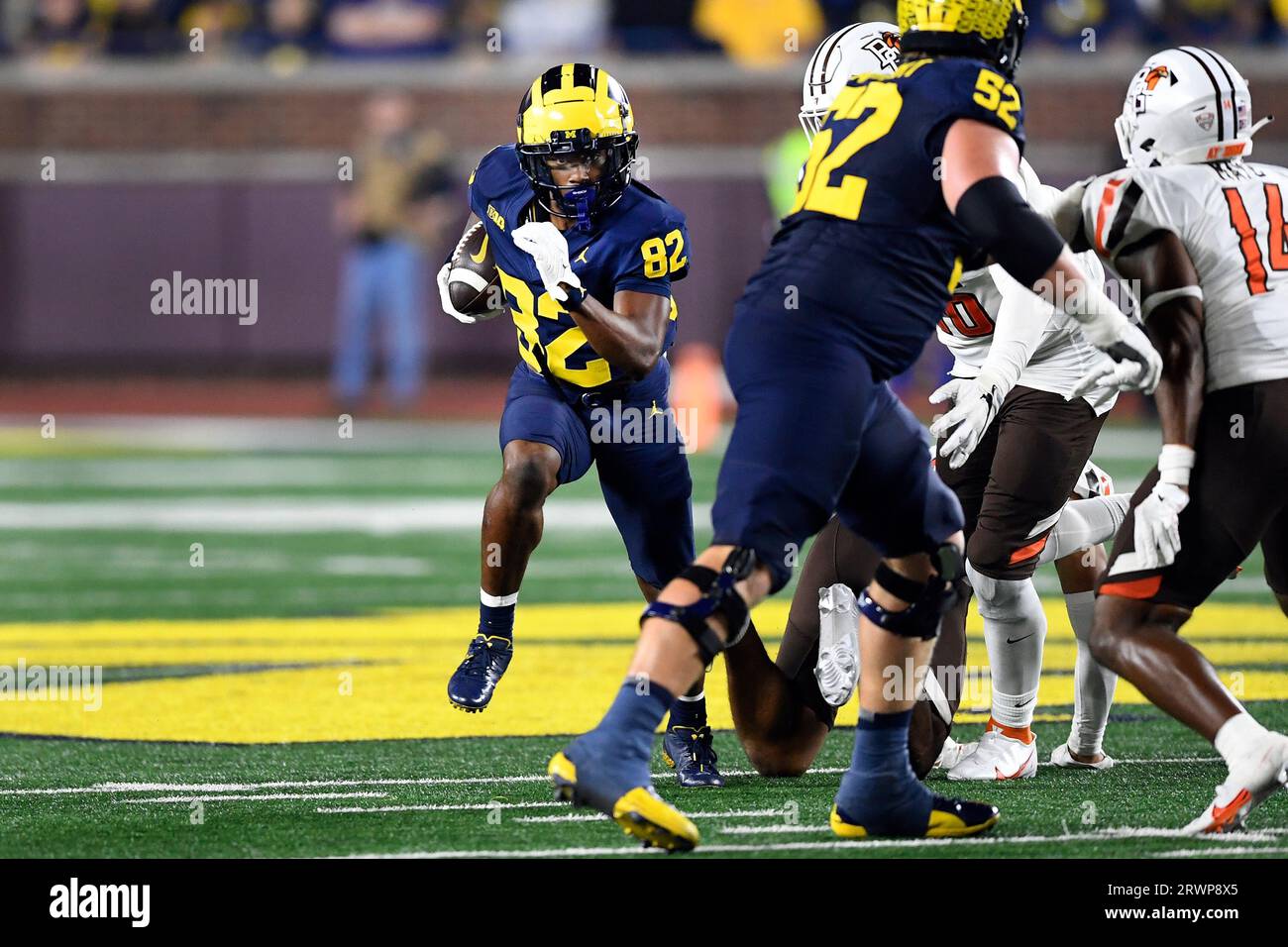 Michigan wide receiver Semaj Morgan, left, runs with the ball against ...