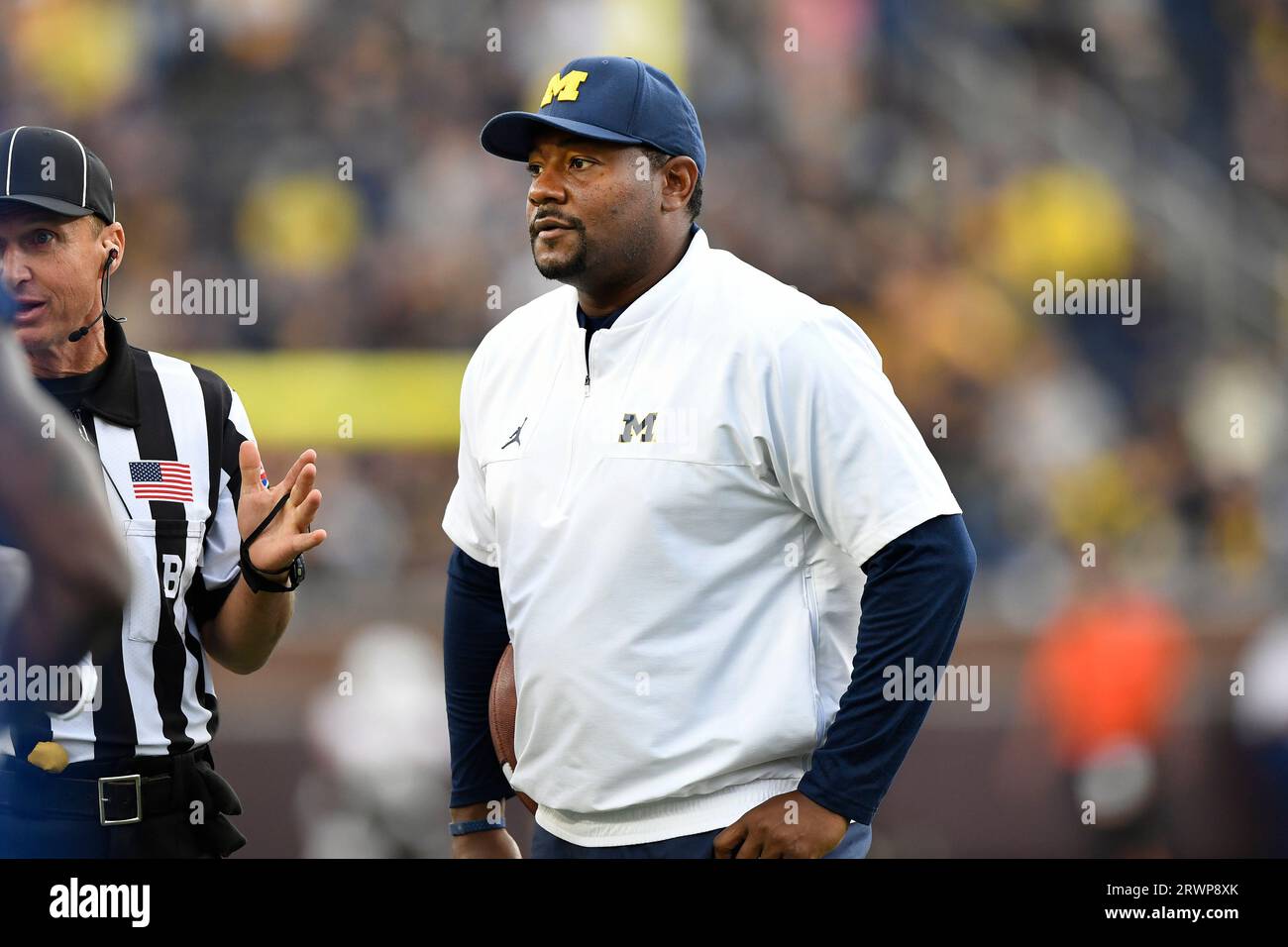 Michigan wide receivers coach Ron Bellamy listens before an NCAA ...
