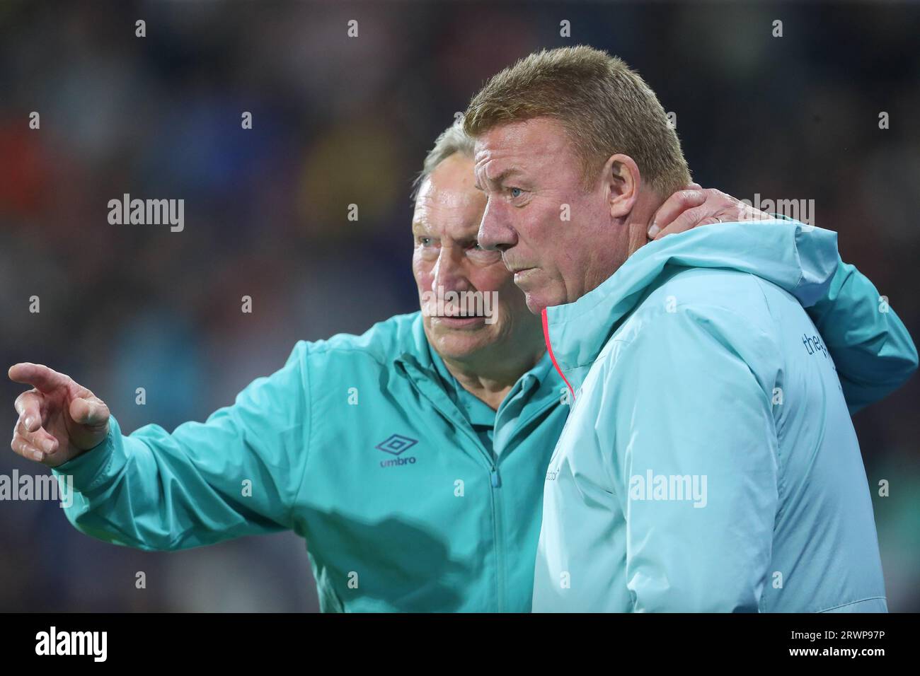 Neil Warnock manager of Huddersfield Town talks with Ronnie Jepson ...