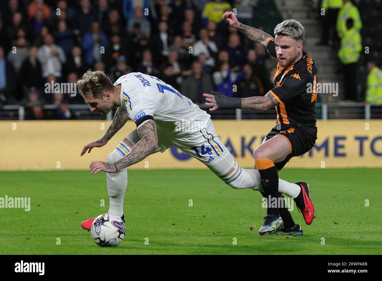 Aaron Connolly #44 of Hull City fouls Joe Rodon #14 of Leeds United ...