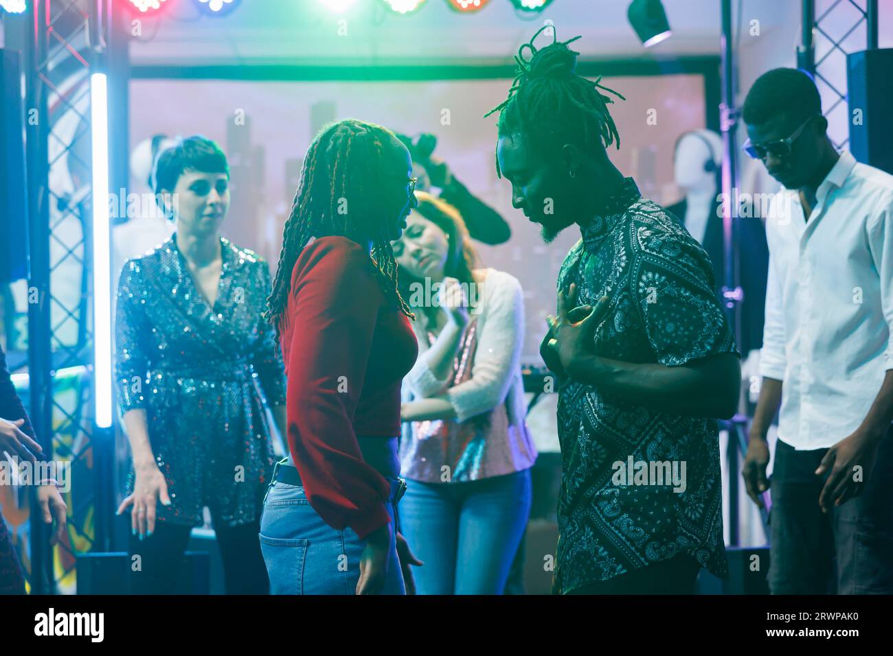 African american man and woman couple dancing and battling while ...