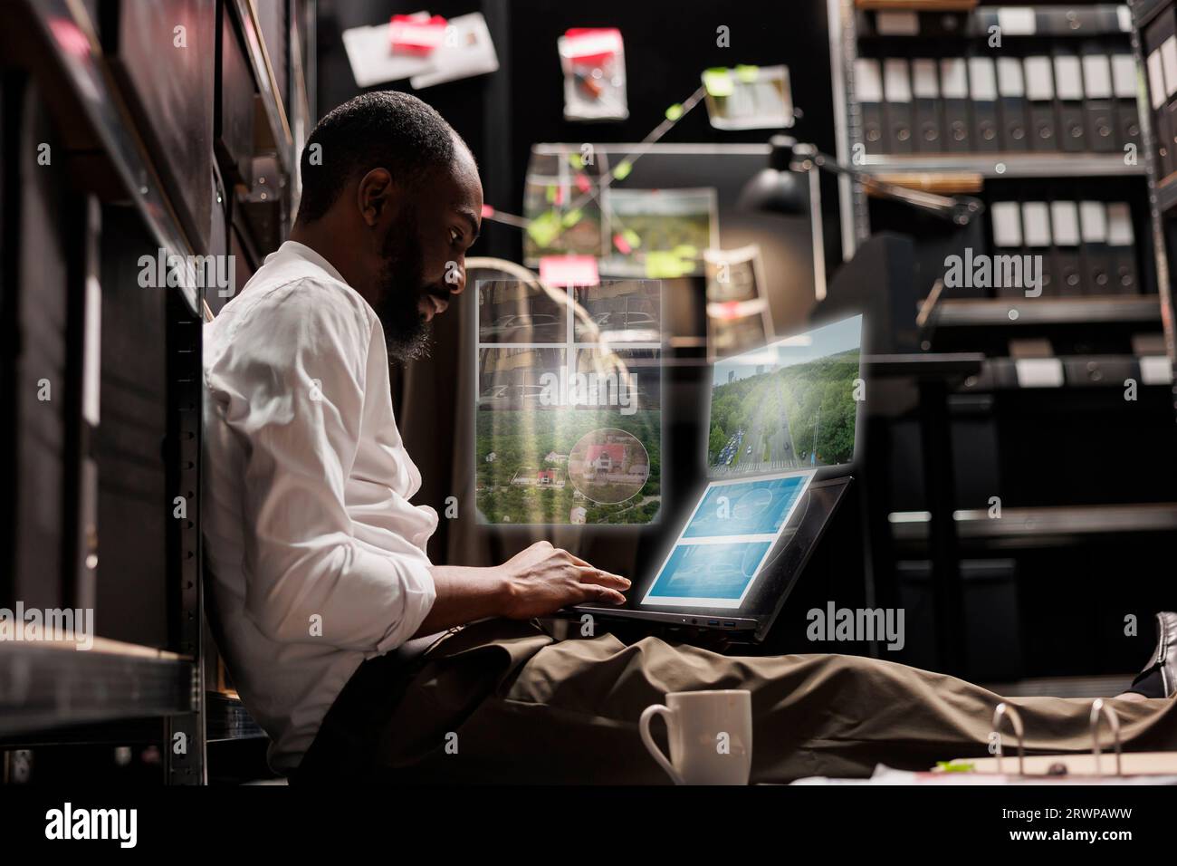 Professional investigator examining hologram hi-res stock photography ...