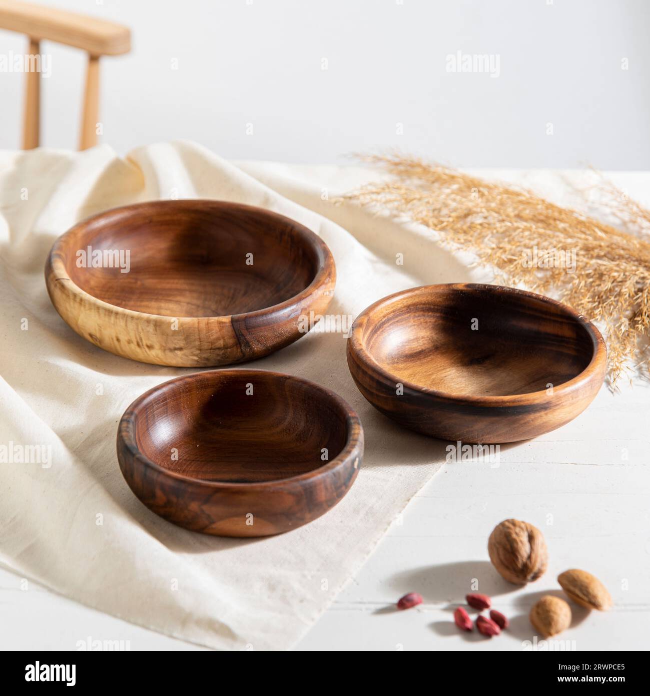 handmade wooden craft bowls on white table Stock Photo - Alamy