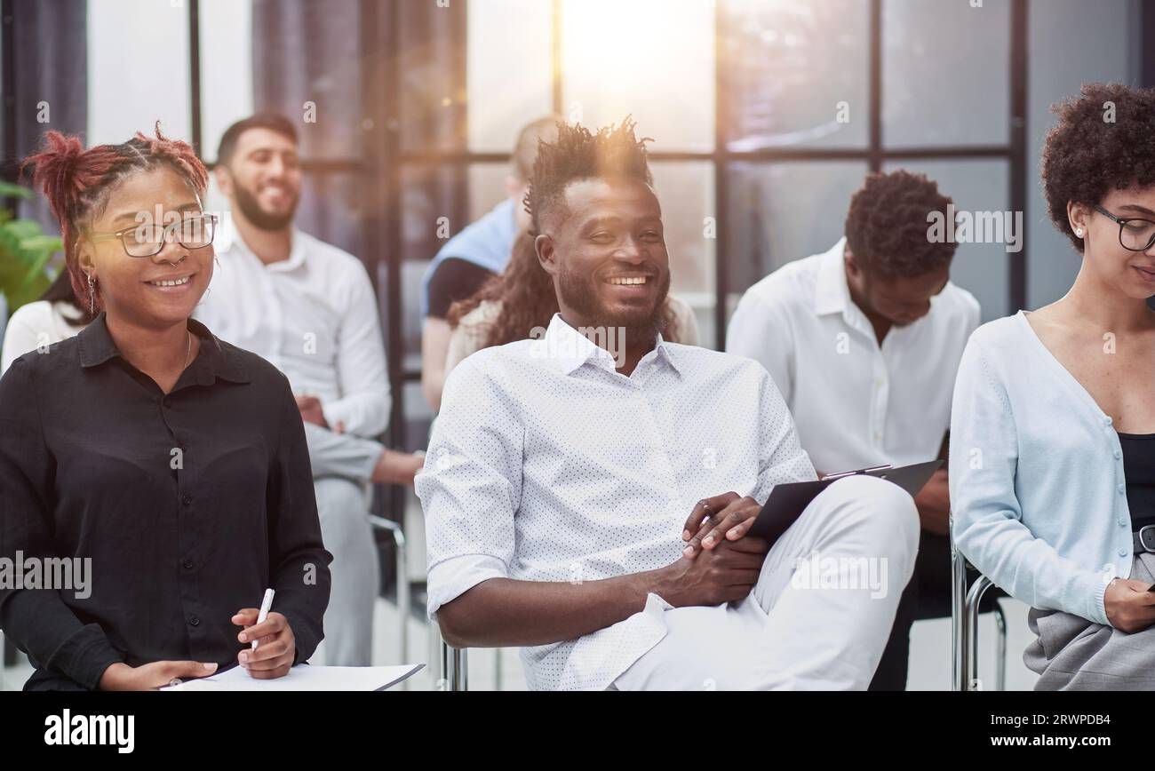 Business crowd in auditorium listeing to speech Stock Photo - Alamy