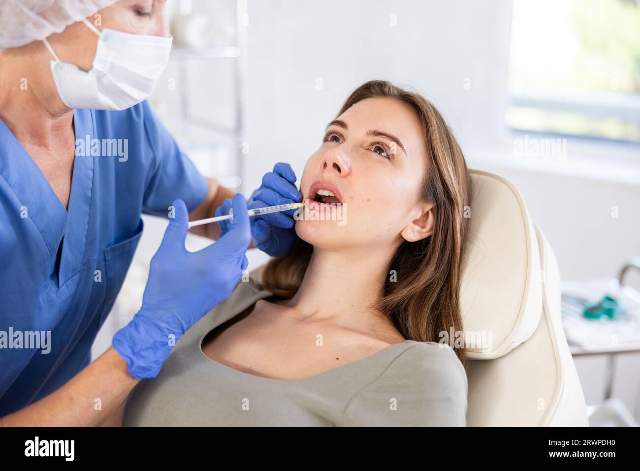 Facial injection young patient, closeup Stock Photo - Alamy