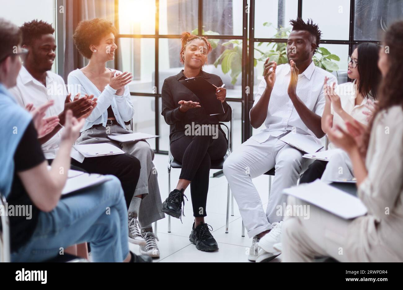 Business lecture. Happy executives , listening his speech in boardroom ...