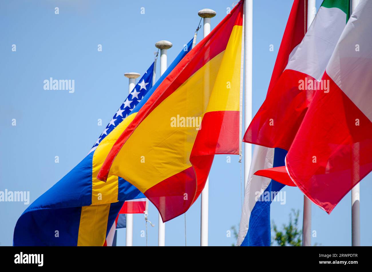 flags of different countries fluttering in the wind Stock Photo - Alamy