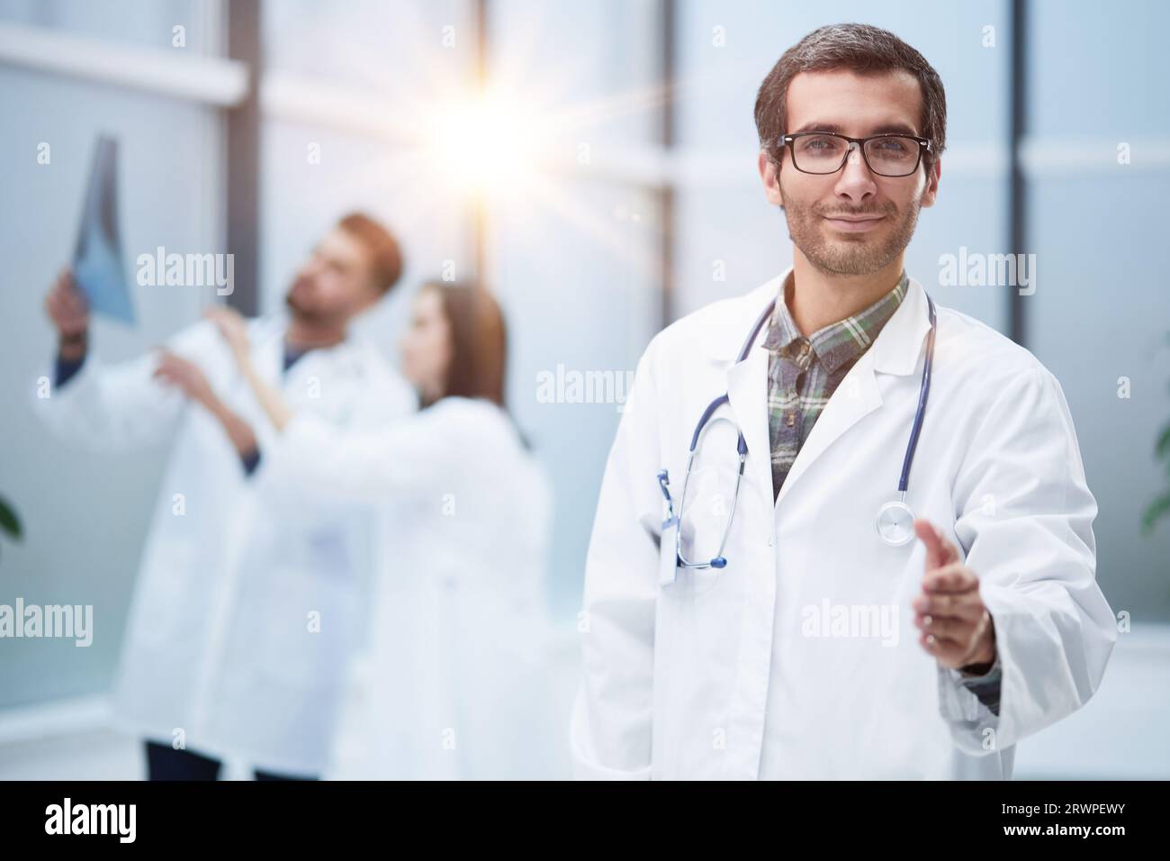 image of the doctor holding out his hand for greeting Stock Photo - Alamy