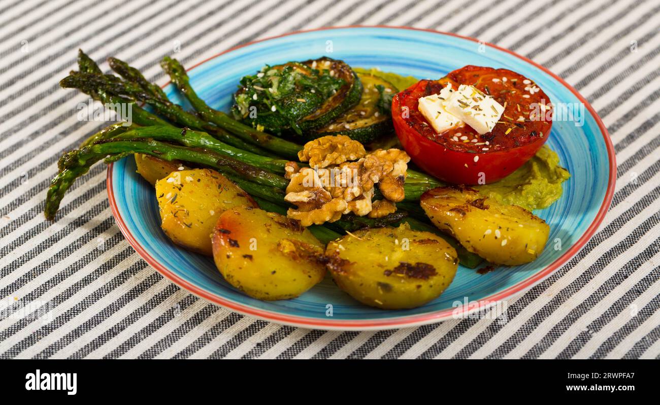 Baked vegetables with welnut is tasty vegeterian dish Stock Photo - Alamy