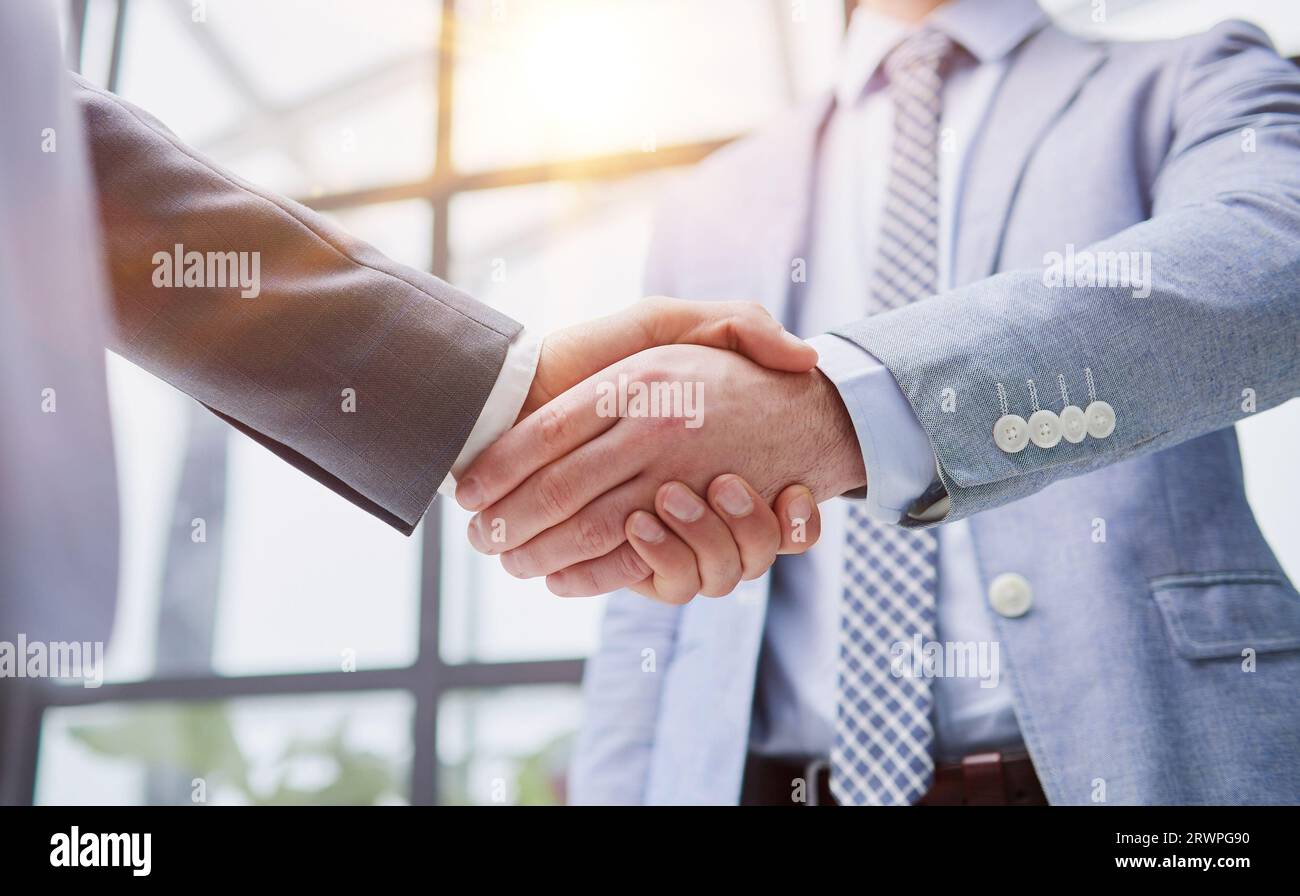 businessman standing greeting partner with handshake. Leadership, trust ...