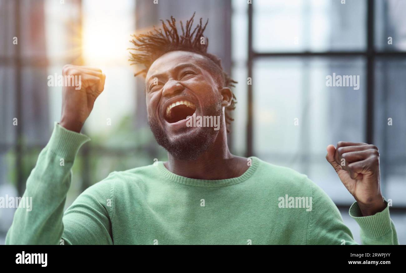 Man rejoices victory hi-res stock photography and images - Alamy