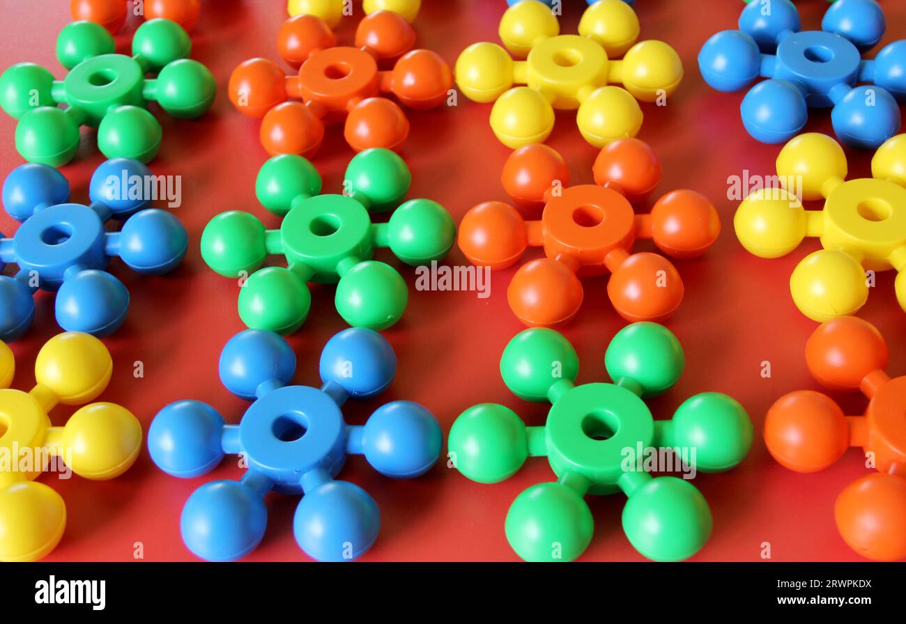 Pieces of plastic rainbow multicolored buildable toy blocks formed and ...