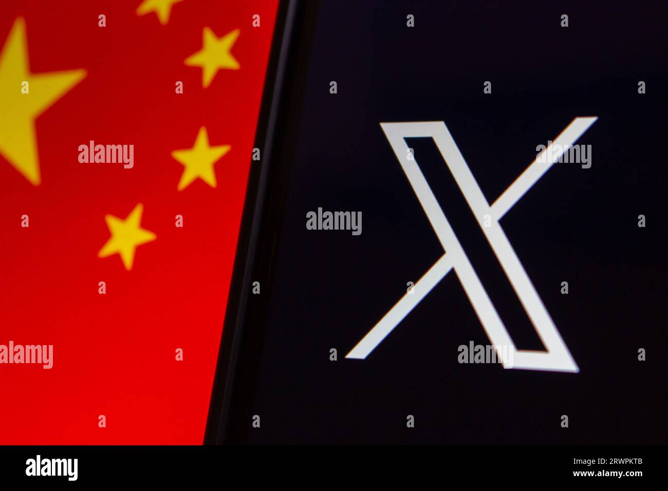 Vancouver, CANADA - Sep 4 2023 : Logo of X App (formerly Twitter) platforms inc on Chinese flag ...