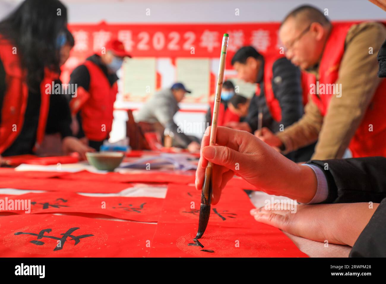 LUANNAN COUNTY, China - January 28, 2022: calligraphers write ...