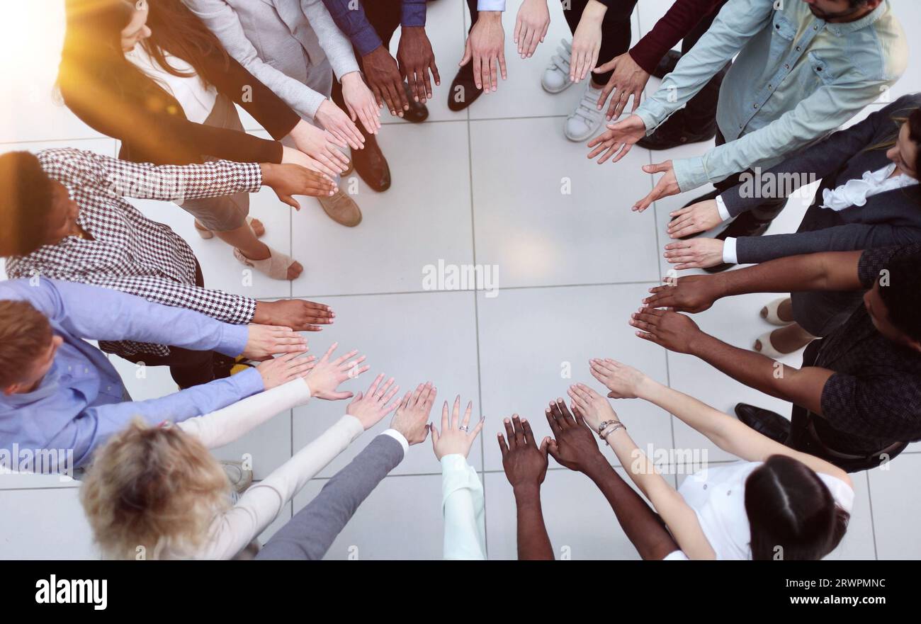 Business people stretched out their hands towards each other while ...