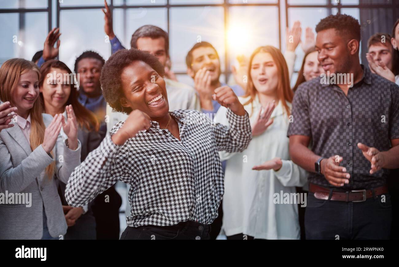 Business team celebrating a triumph with arms up Stock Photo - Alamy